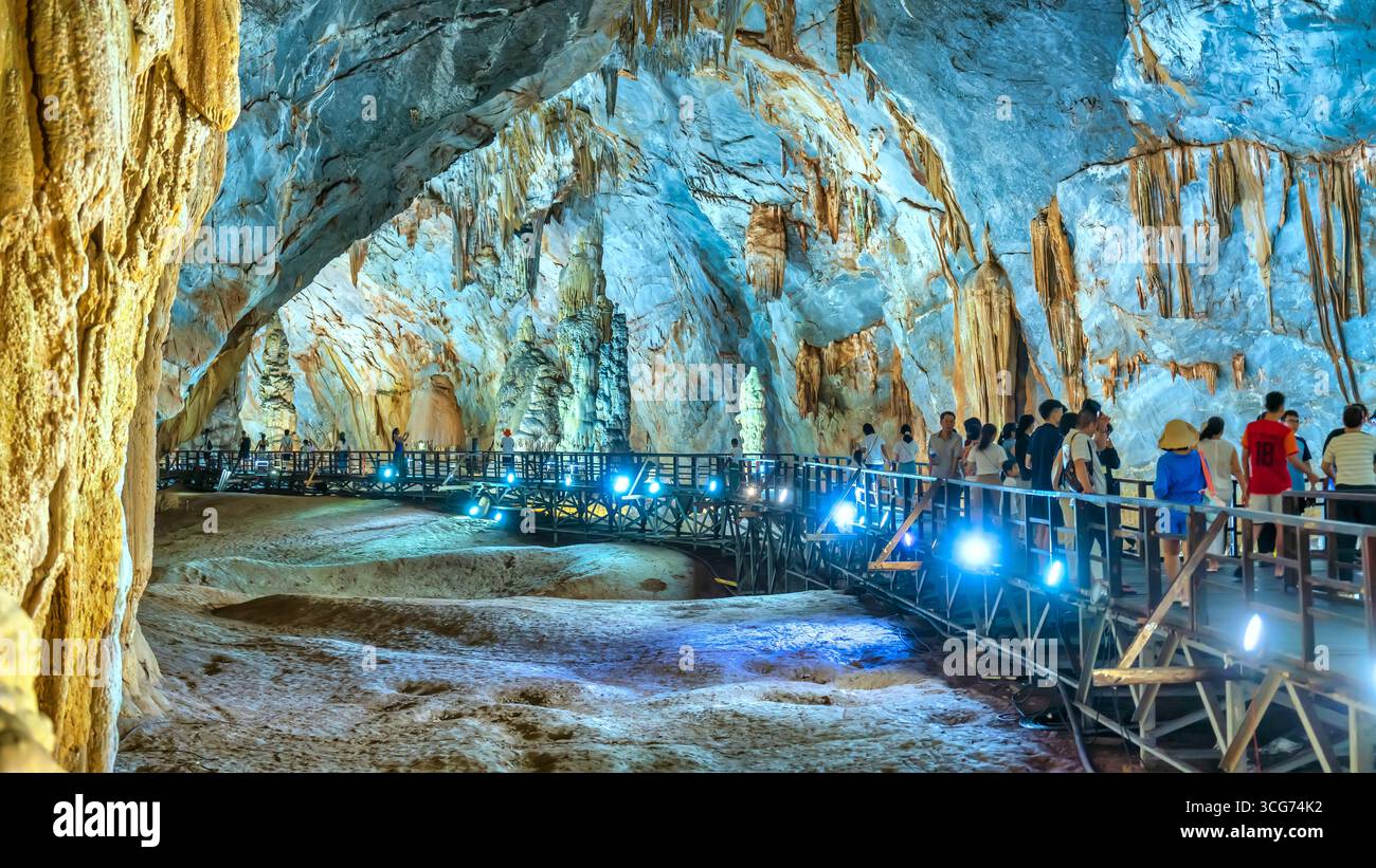 Tourists visit on wooden walkway through scenic natural corridor ...