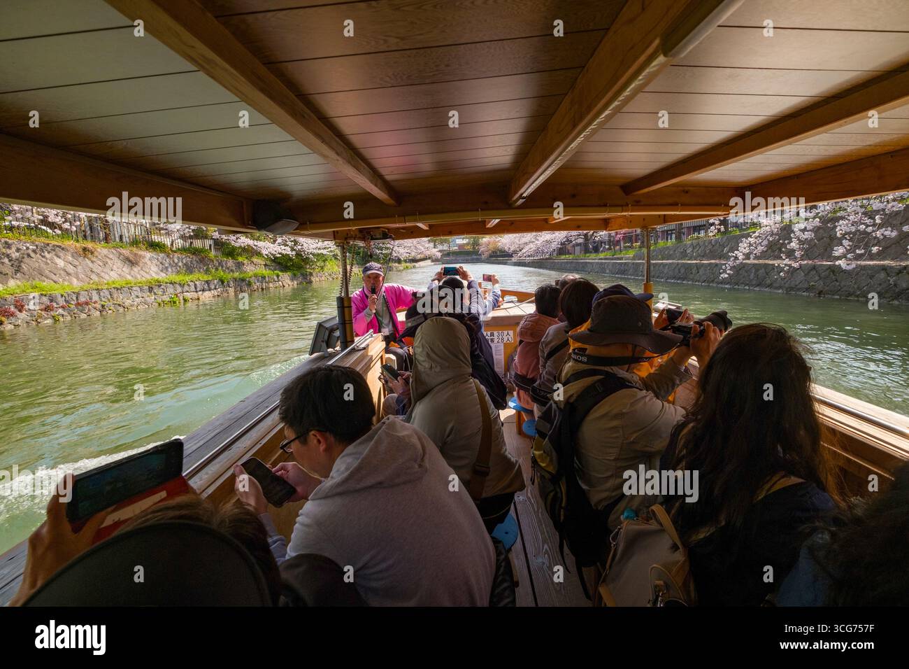 Tourist sitting in Okazaki Jikkokubune Boat on tour of the Okazaki ...