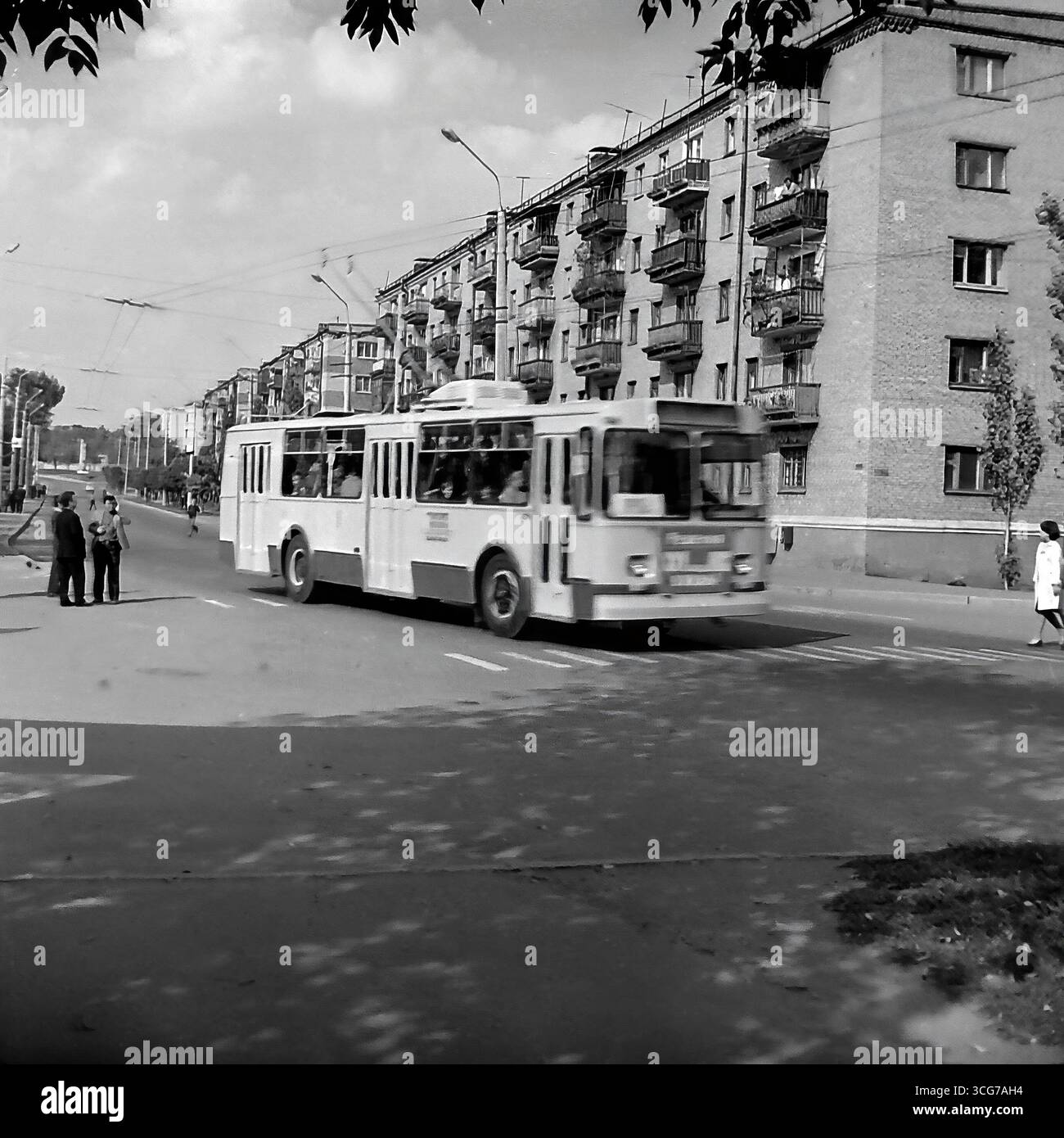 Archival photo of a city trolleybus ZiU-9 with a festive sign "300 ...
