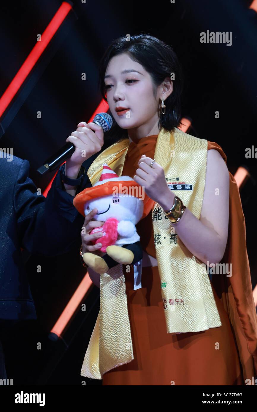 Chinese singer-songwriter Curley G attends an activity in Shanghai ...