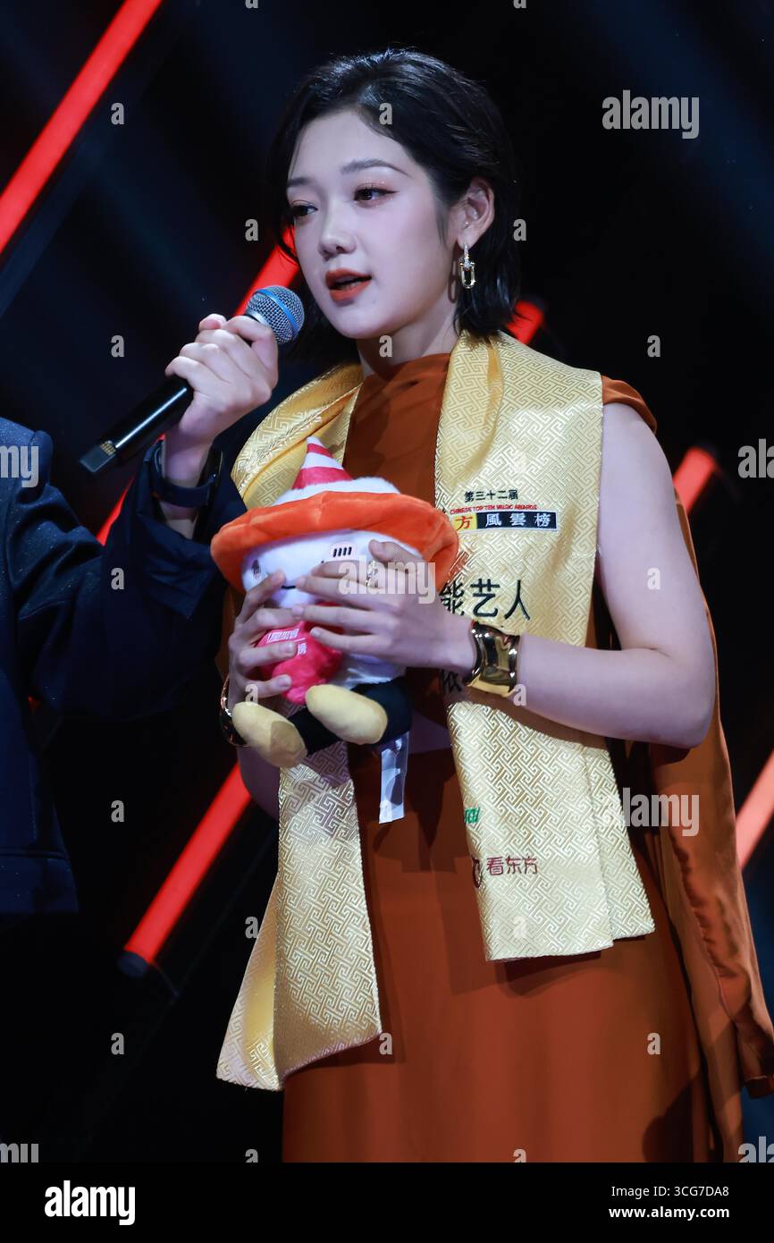Chinese singer-songwriter Curley G attends an activity in Shanghai ...