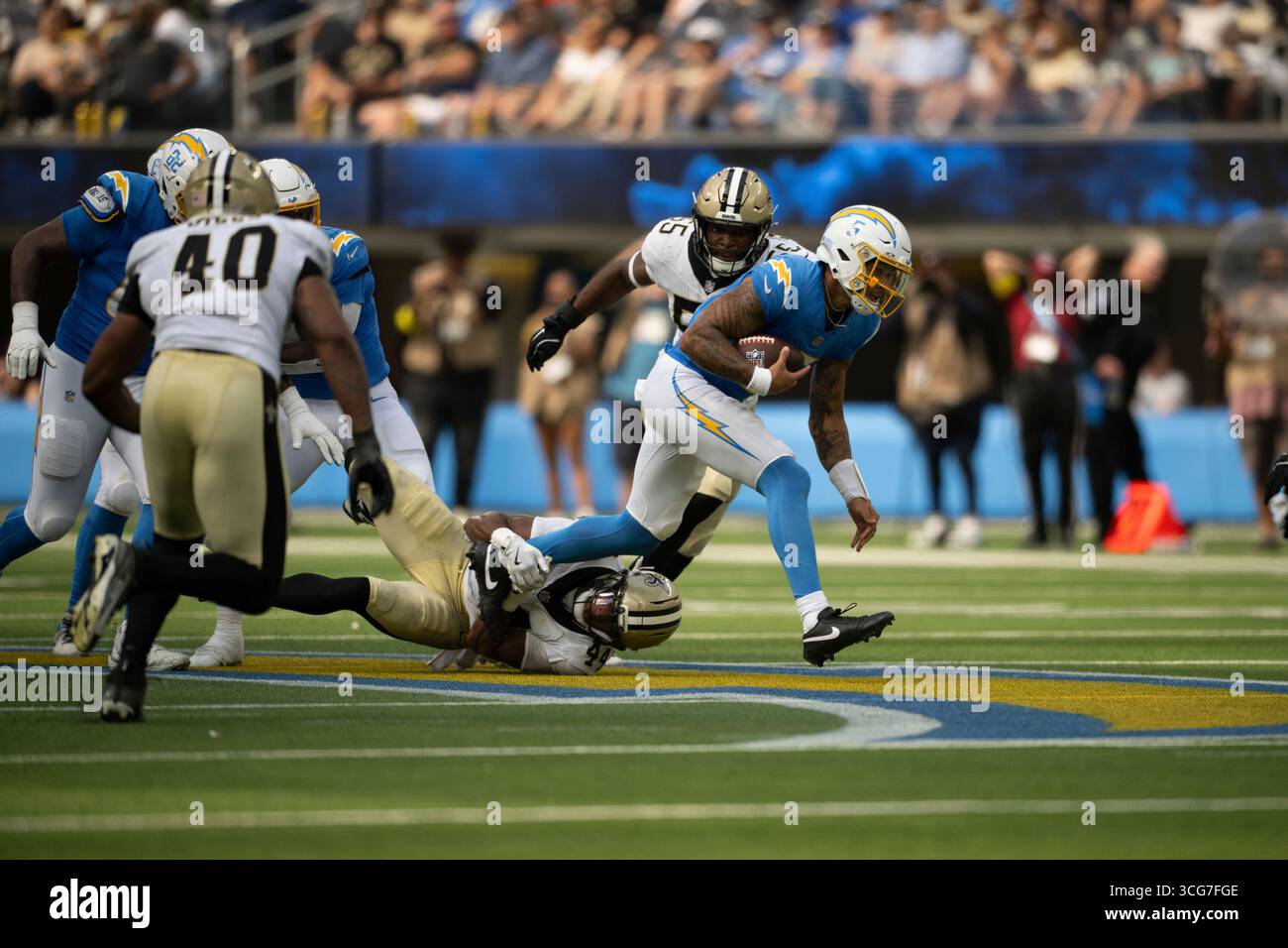Los Angeles Chargers quarterback Trey Lance (5) runs with the ball as ...