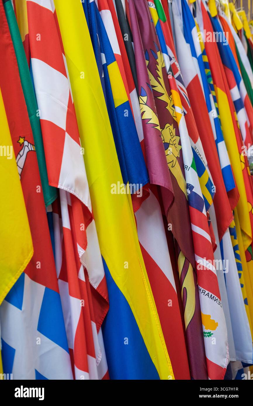 A colorful display of international flags hanging together. Symbolizing ...