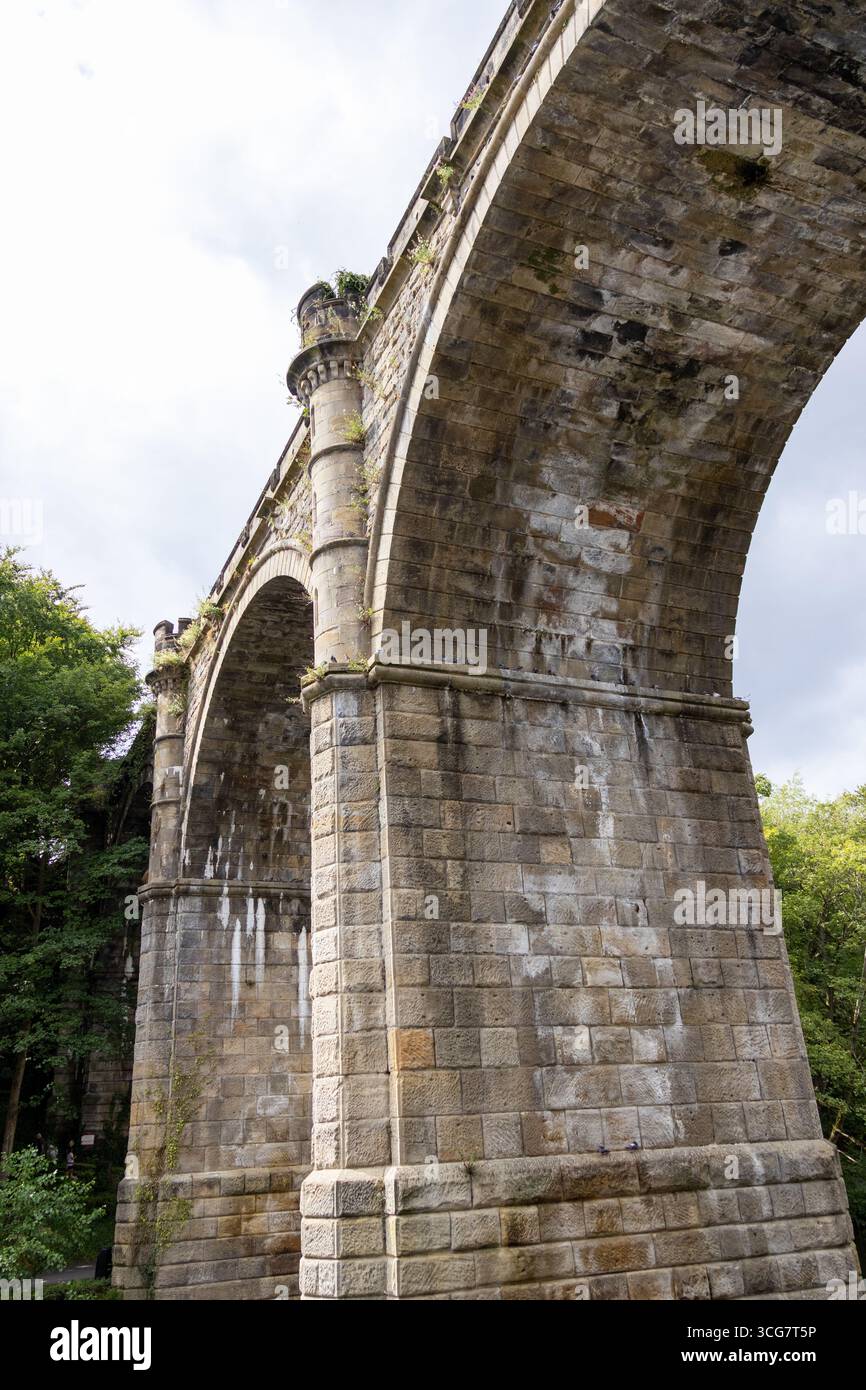 Close-up low angle view of the massive stone arches of a historic ...