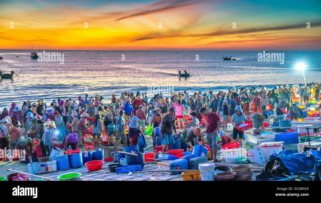 Vietnamese Tam Tien Fish Market on the beach by the sea in morning at ...