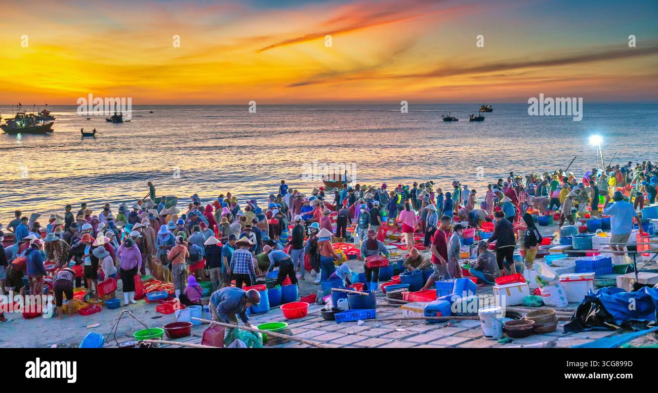 Vietnamese Tam Tien Fish Market on the beach by the sea in morning at ...