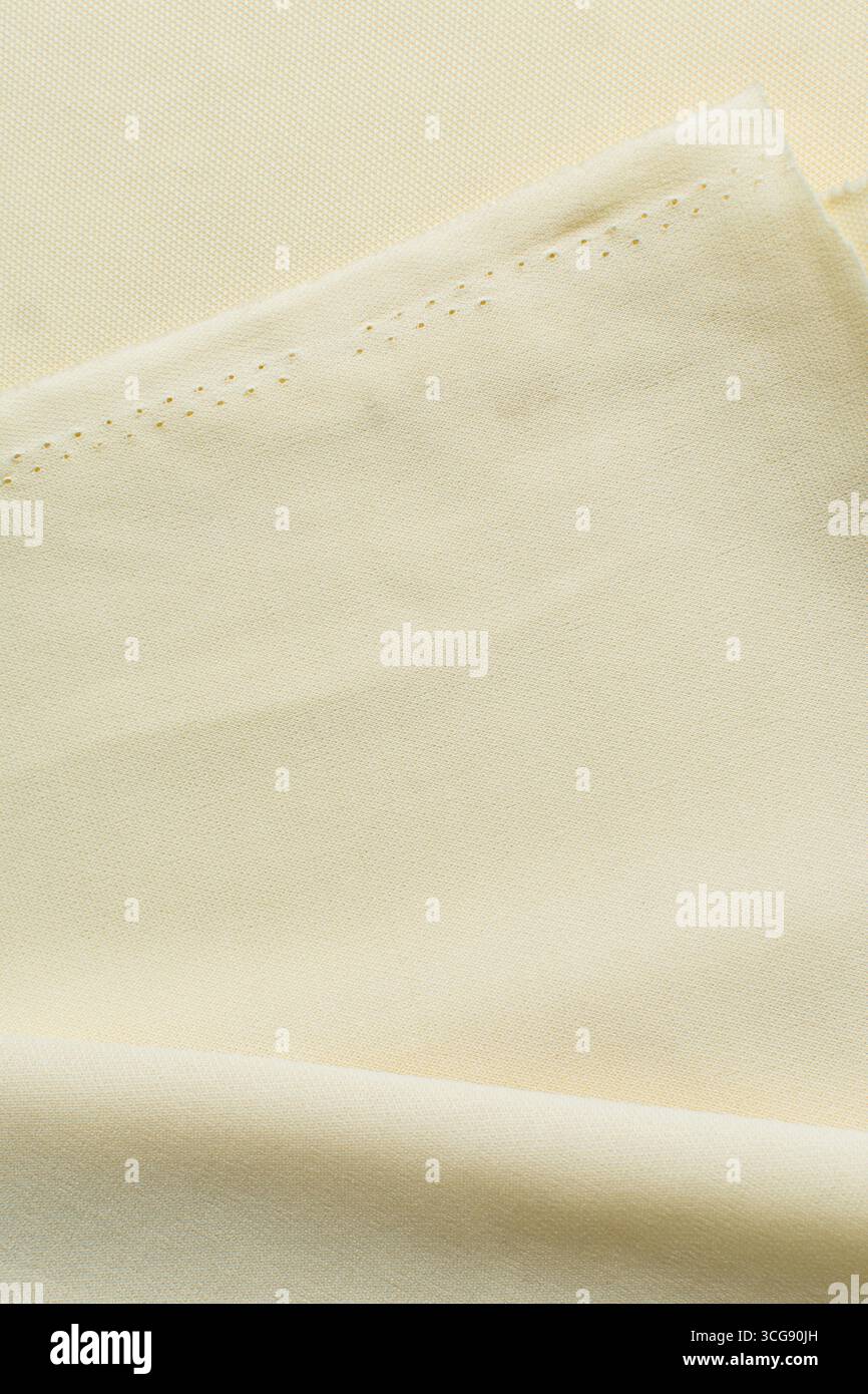 Overhead view of cream scuba fabric, close of view of textured neoprene ...