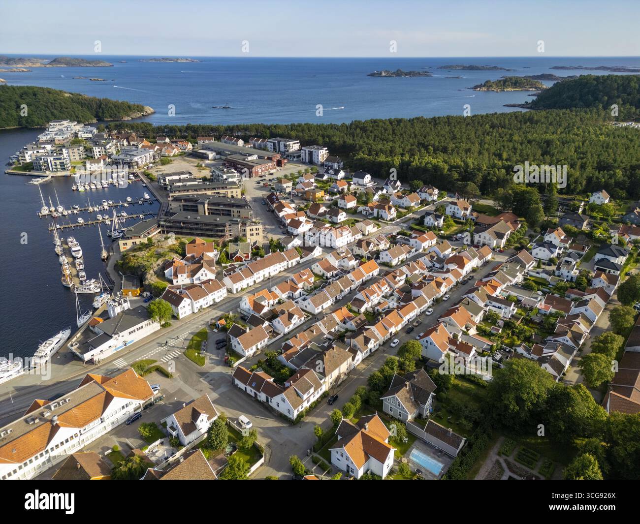 Aerial view of the vibrant coastal town nestled between the serene ...