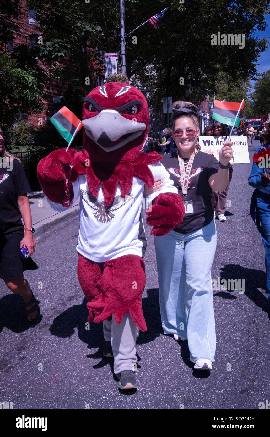 The mascot from Nyack high school and the school superintendent march ...