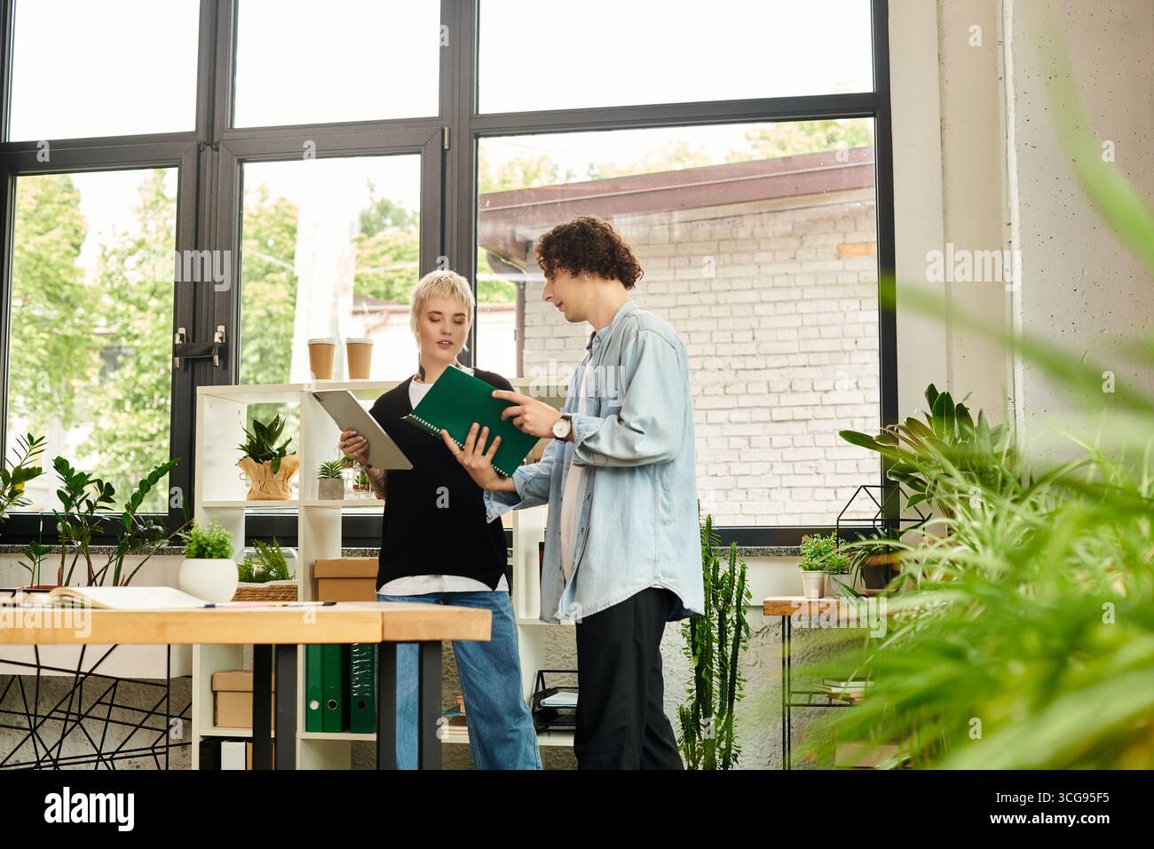 Two youth collaborate share hi-res stock photography and images - Alamy