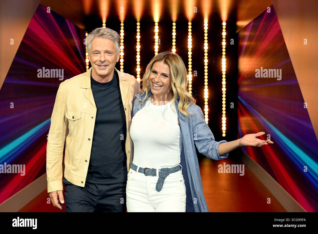 27 August 2025, Bavaria, Grünwald: Michelle Hunziker and Jörg Pilawa ...