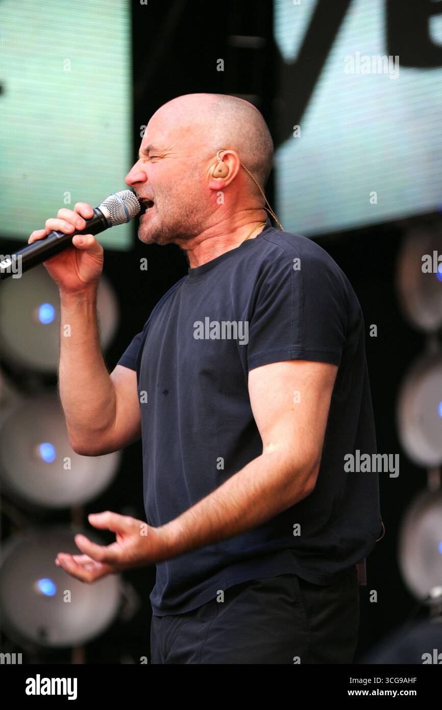 Phil Collins performing with Genesis at "Live Earth" at Wembley Stadium ...
