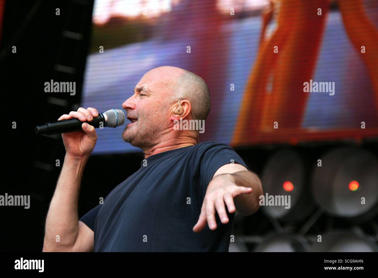 Phil Collins performing with Genesis at "Live Earth" at Wembley Stadium ...