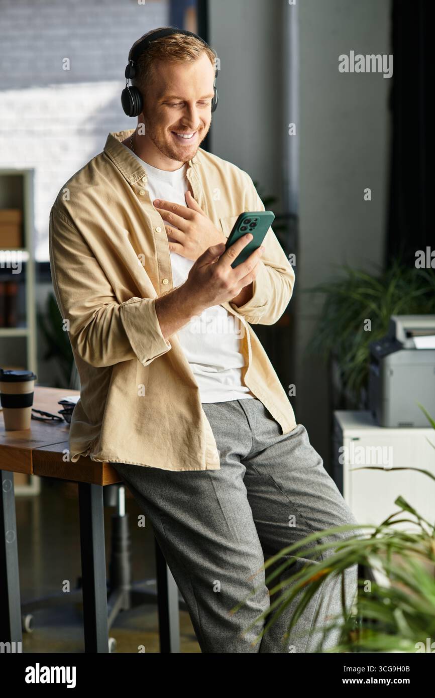Handsome businessman enjoys a moment of connection while using his ...