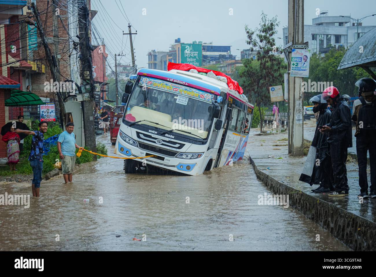 August 27, 2025, Bhaktapur, Bagmati, Nepal: A bus stuck in rainwater on ...