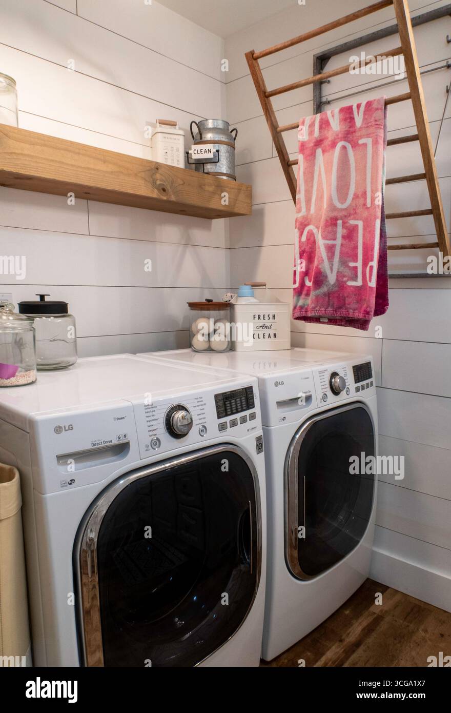 Modern tiled laundry room in a residential suburban house in Montana ...