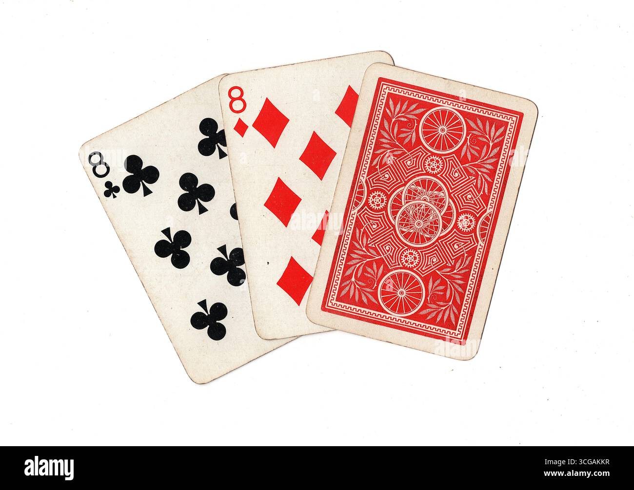 A hand of vintage playing cards showing a pair of eights revealed ...