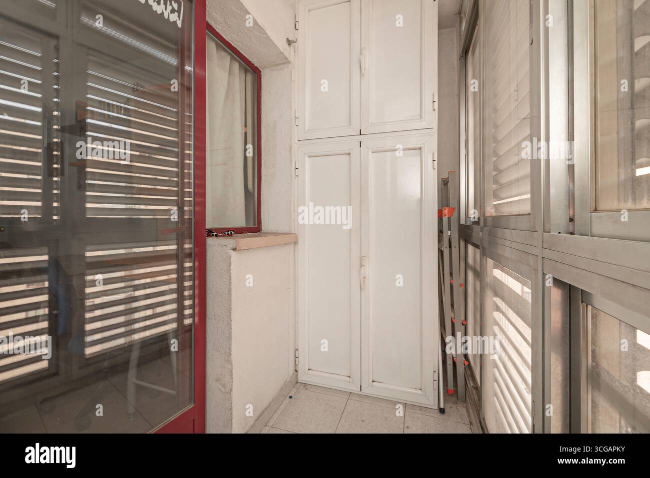 Double-height terrace windows with a gray aluminum frame that ...