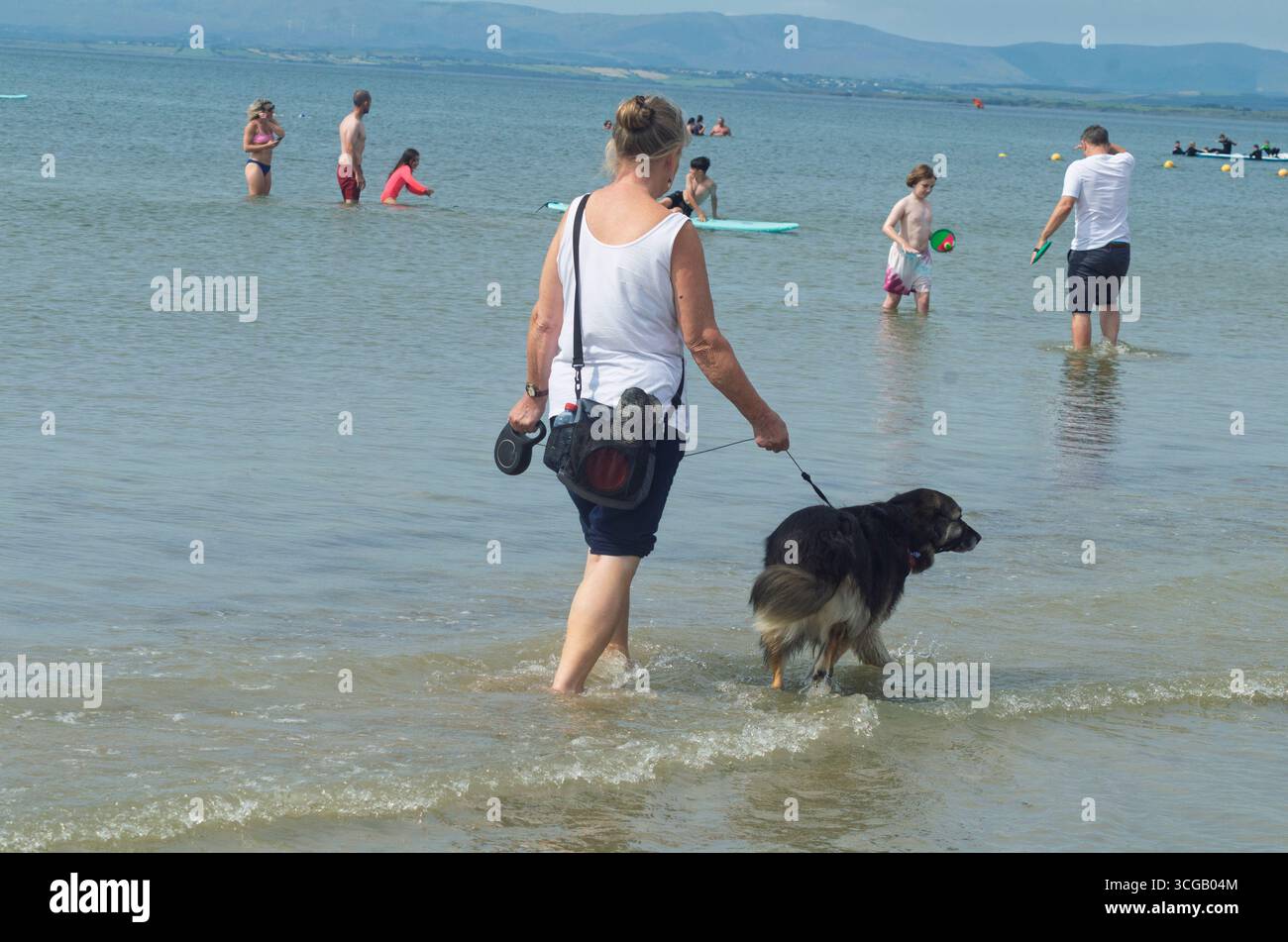 Rossnowlagh Co. Donegal Ireland August 19 2025 - Woman and her dog ...