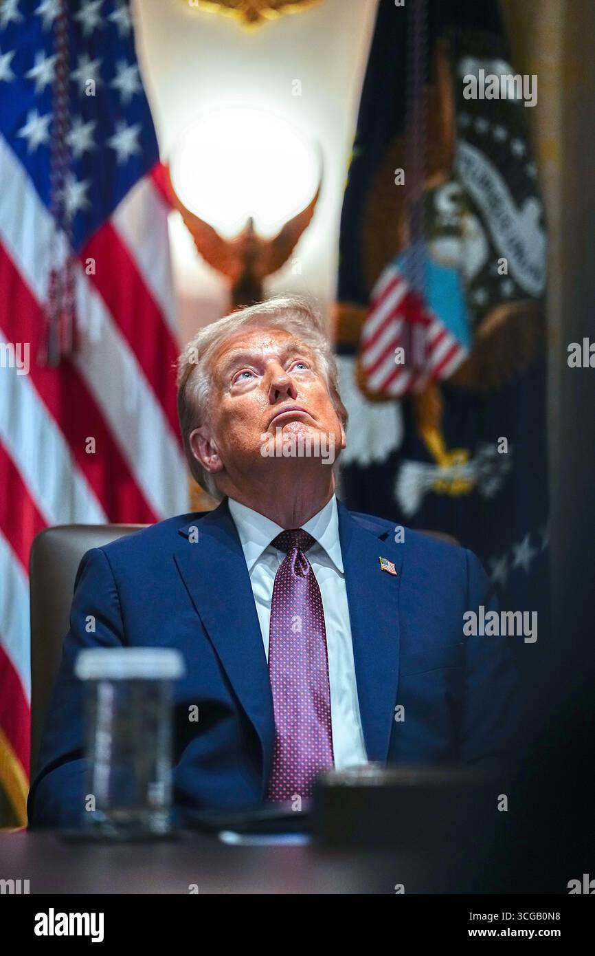United States President Donald J Trump looks at the ceiling as he ...