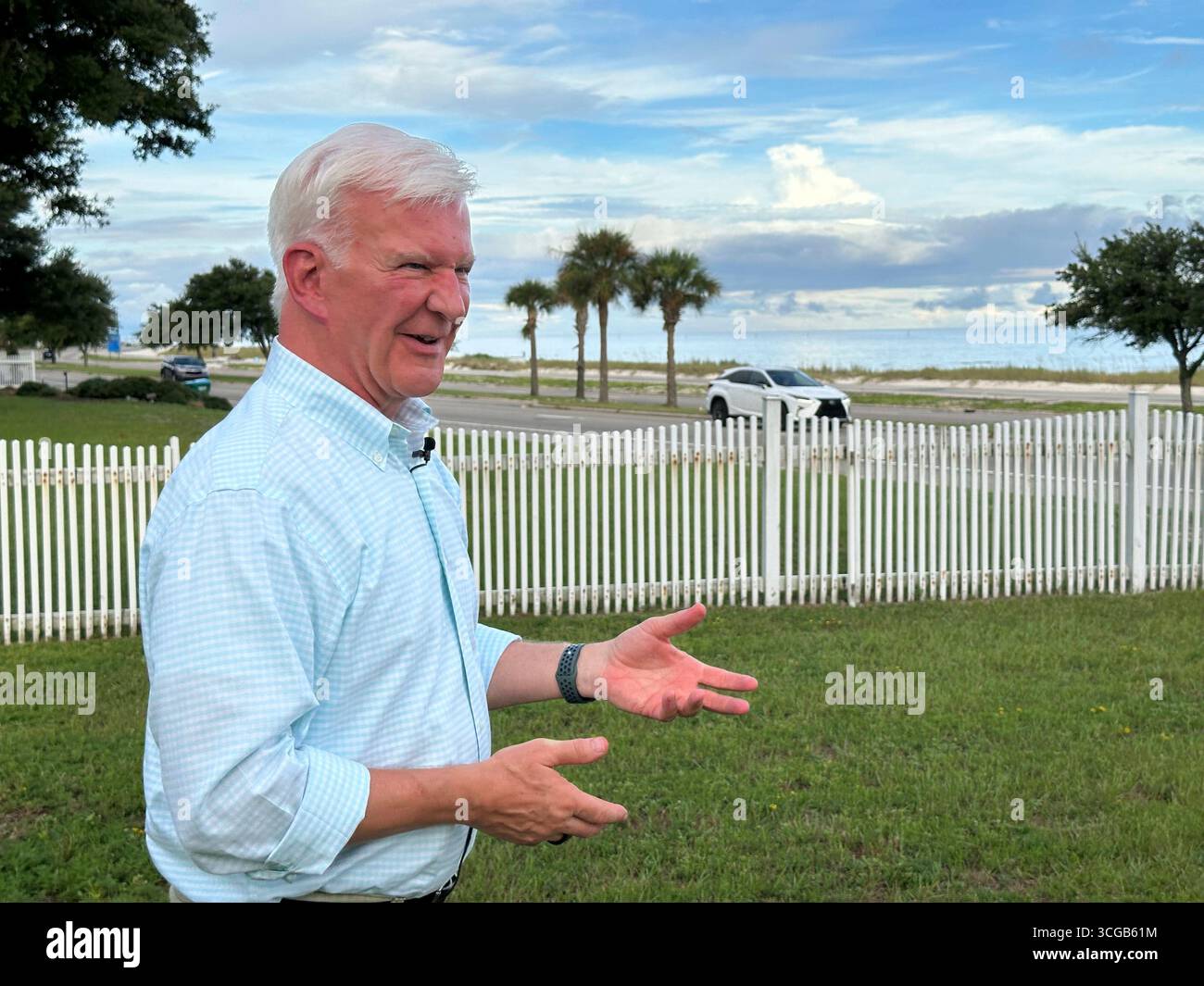 Overlooking the Mississippi Sound, Allen Baker talks in front of his ...