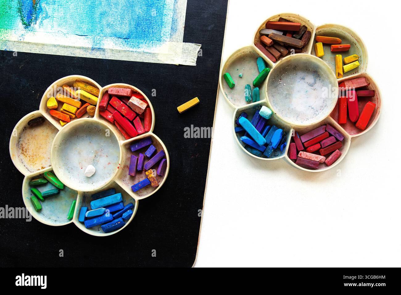 Top view of two pastel chalk palettes filled with colorful pastel chalk ...