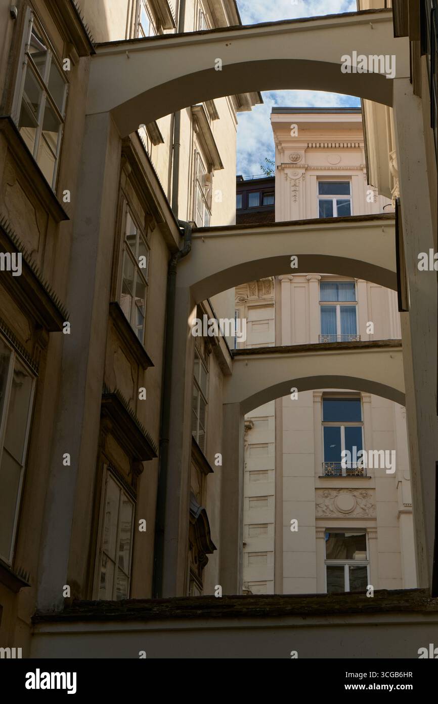 View of three architectural arches connecting buildings in Vienna ...