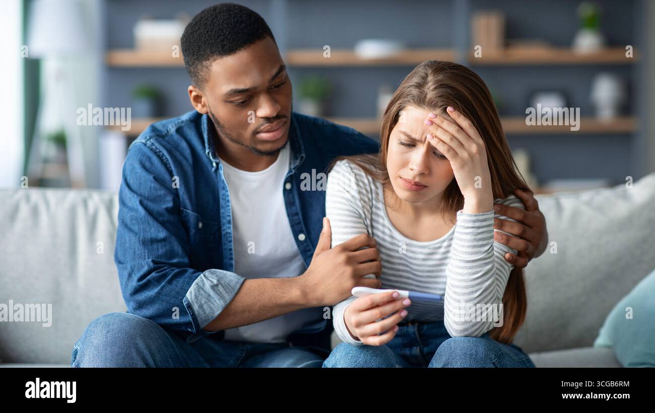 Infertility Problems. Portrait Of Upset Interracial Couple Looking At ...