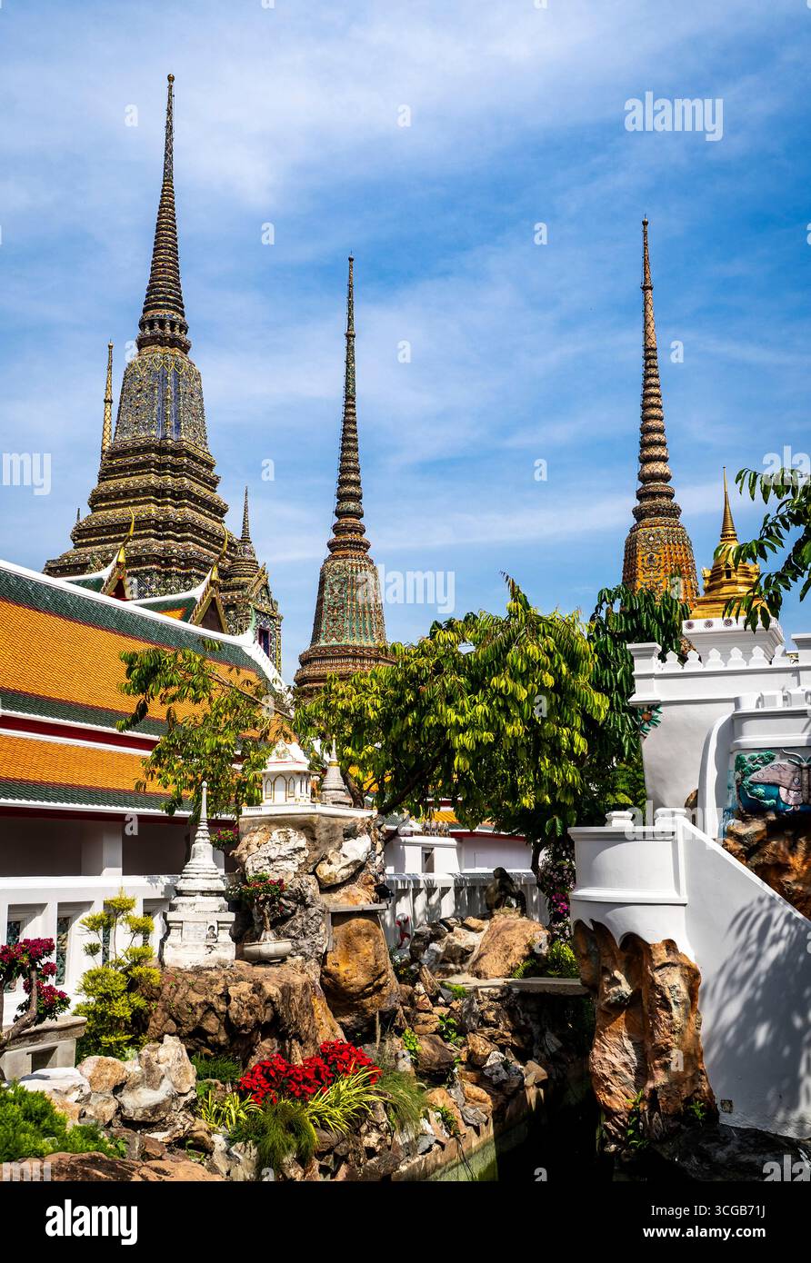 A beautiful view of ornate pagodas and lush greenery in a temple ...