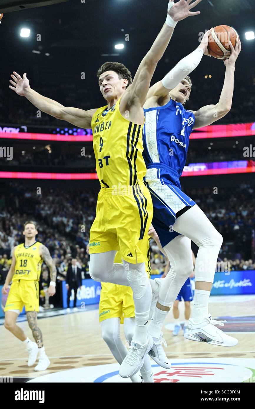 Sweden's Pelle Larsson and Finland's Lauri Markkanen during the ...