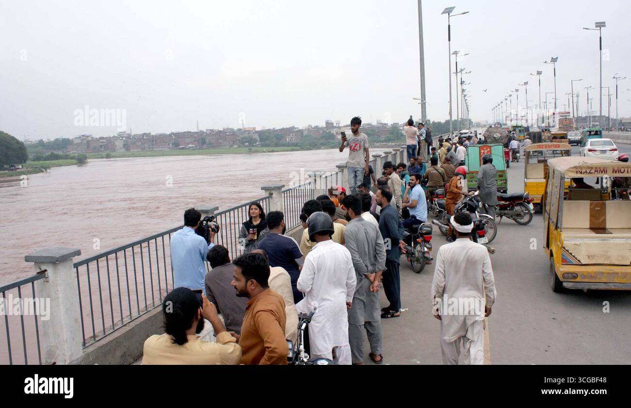 LAHORE, PAKISTAN, AUG 27: Citizens gather and seen worried due to water ...