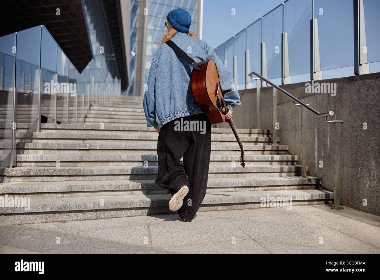 Woman walking upstairs modern glass hi-res stock photography and images ...