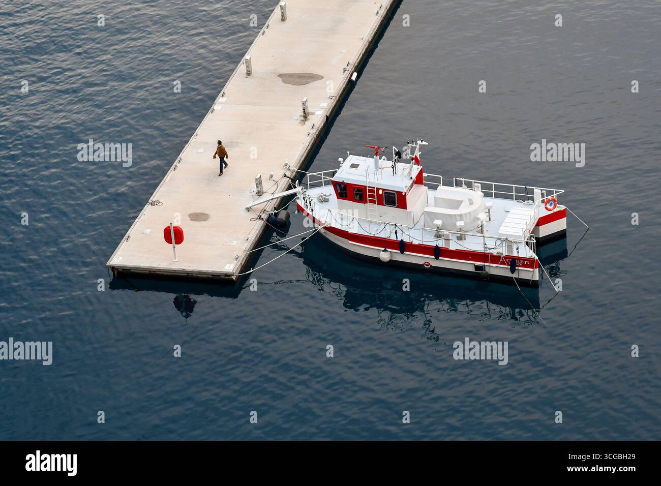 Elevated view of a boat docked at a pier in the Fontvieille marina ...
