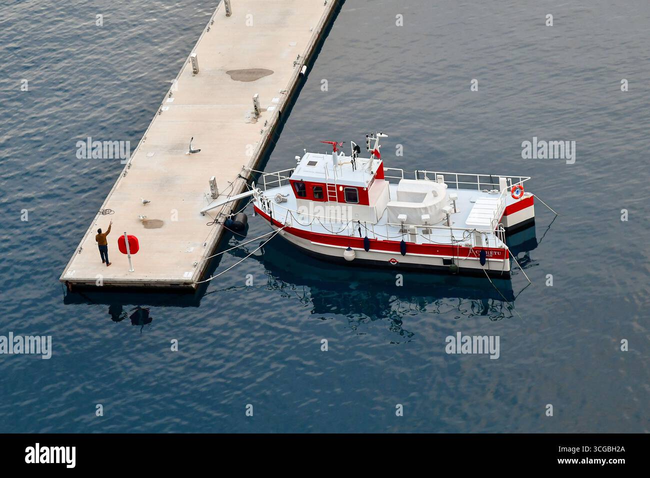Elevated view of a boat docked at a pier in the Fontvieille marina ...