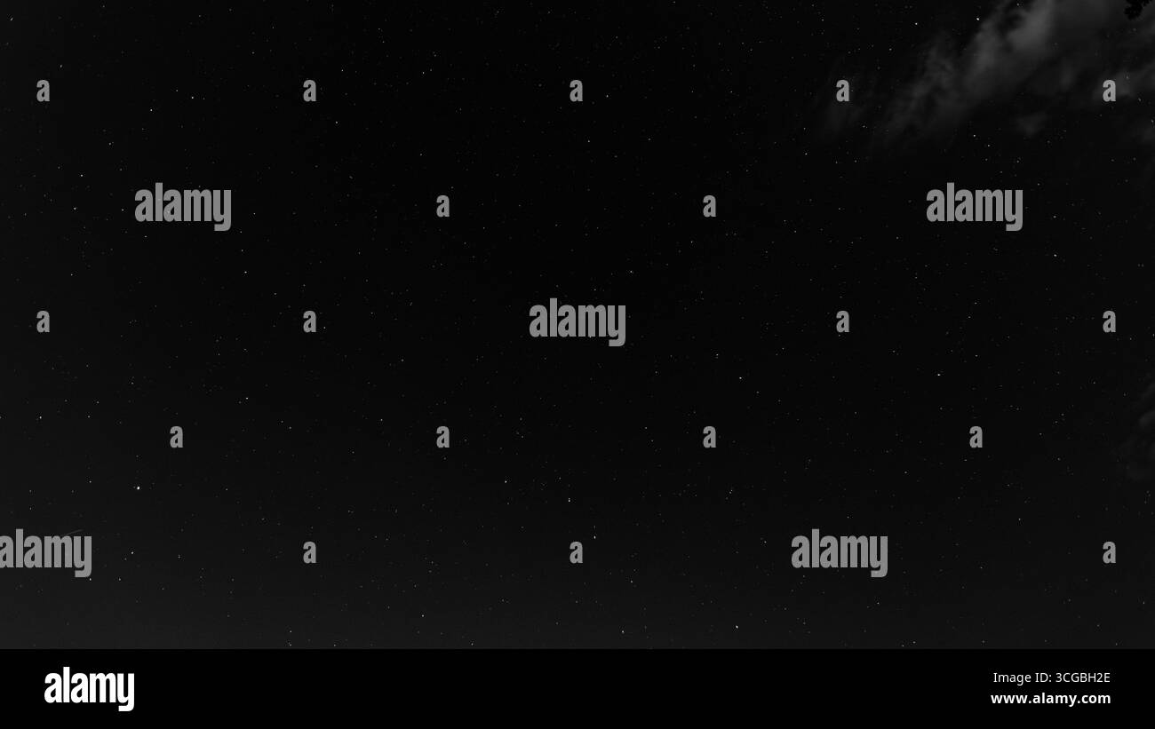 Night sky over mountain silhouettes with countless stars and subtle ...