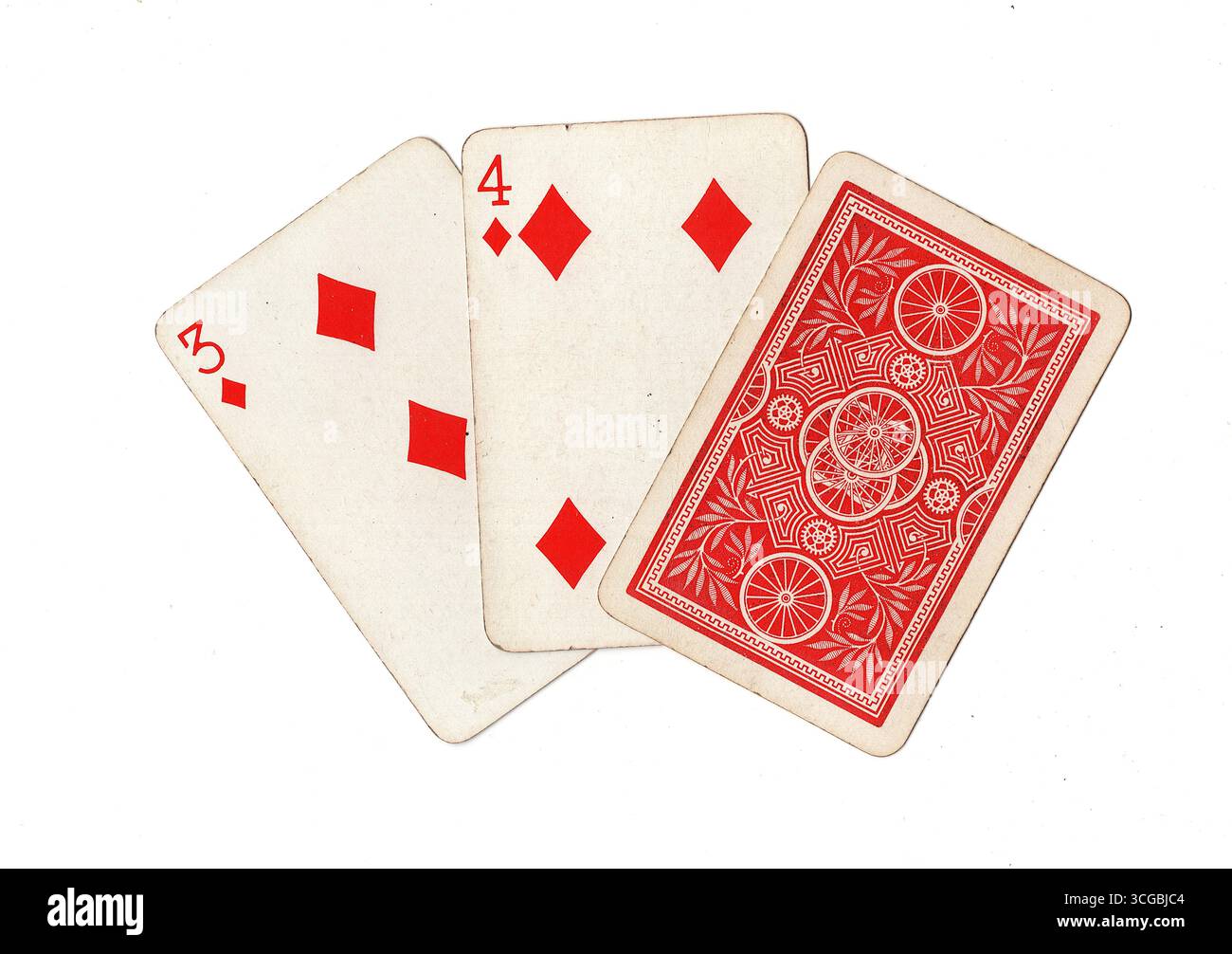 A hand of vintage playing cards showing two cards revealed isolated on ...