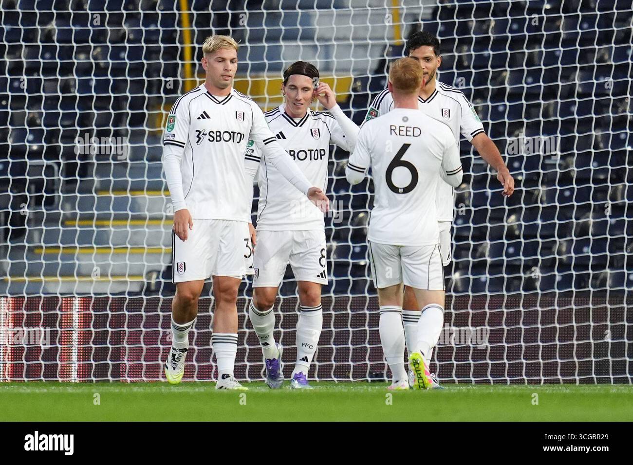 Fulham's Emile Smith Rowe (left) and team-mates celebrate their side's ...