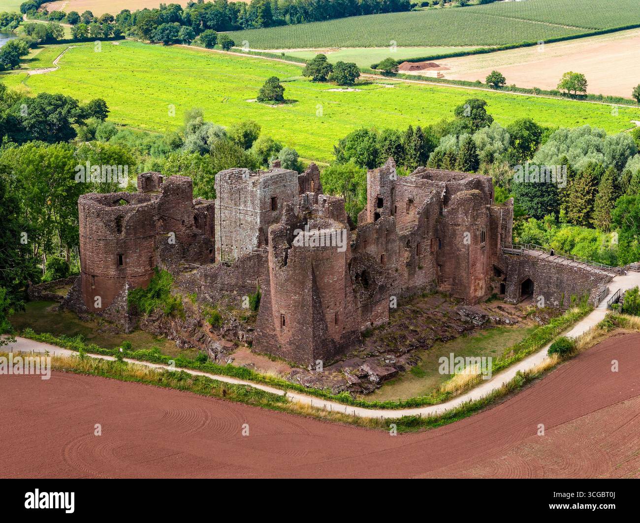 Drone shot of 11th century Goodrich Castle ruins in English countryside ...