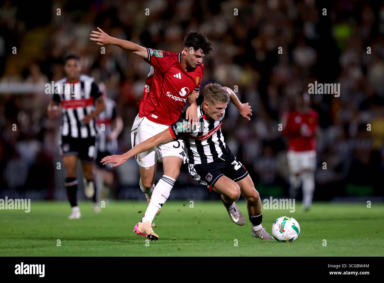 Grimsby Town’s Cameron Gardner (right) battle for possession of the ...