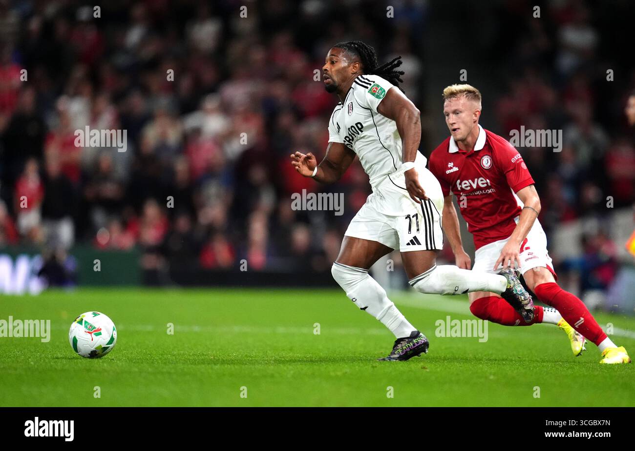 Fulham's Adama Traore (left) and Bristol City's Ross McCrorie battle ...
