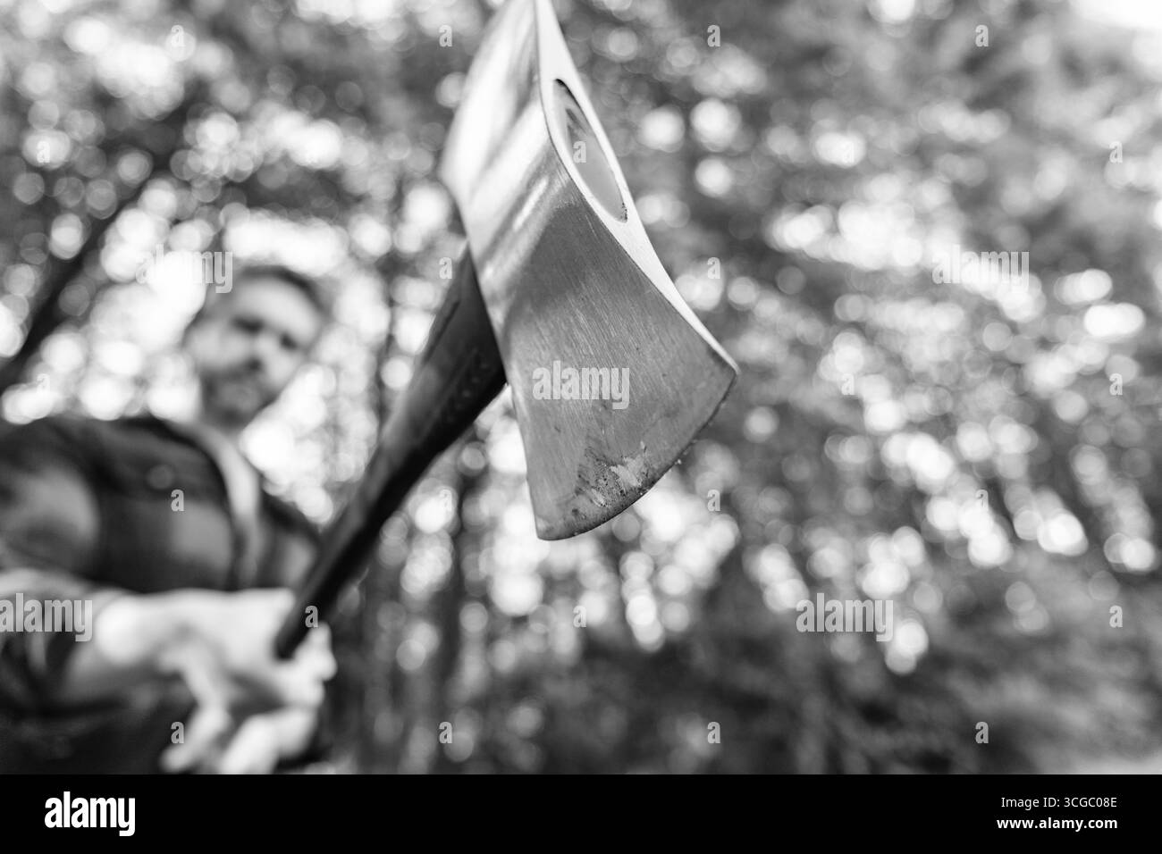 Sharp blade. Brutality and masculinity. Lumberjack with ax selective ...
