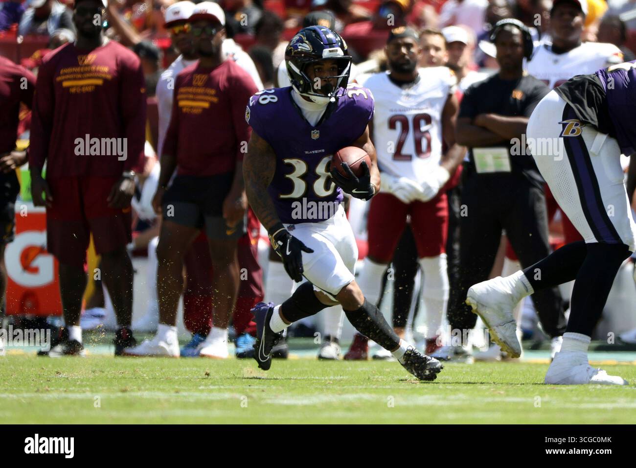 Baltimore Ravens running back Myles Gaskin (38) runs with the ball ...