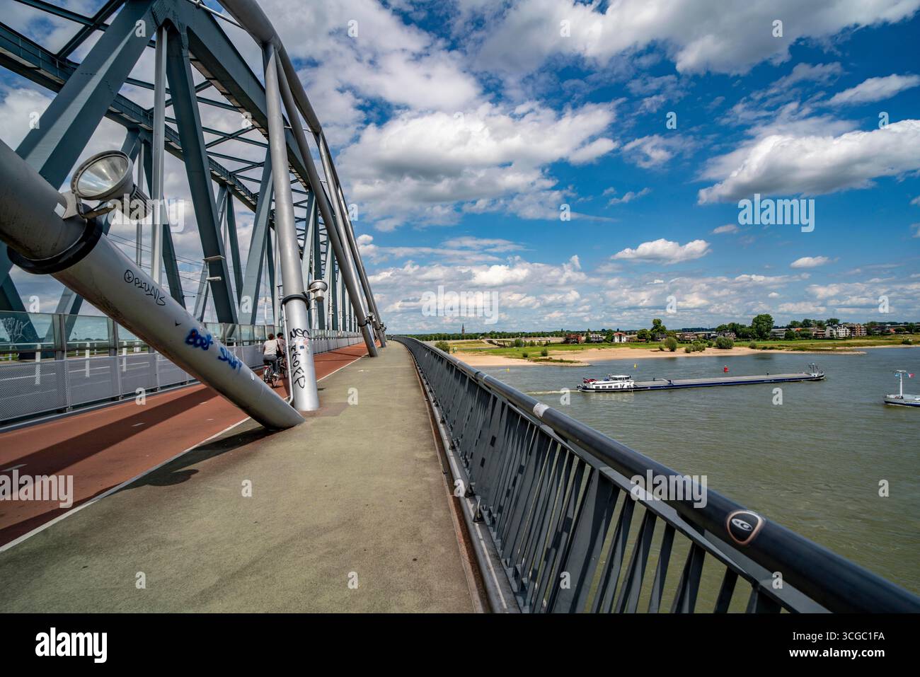 The Snelbinder Brug bicycle and pedestrian bridge over the Waal River ...
