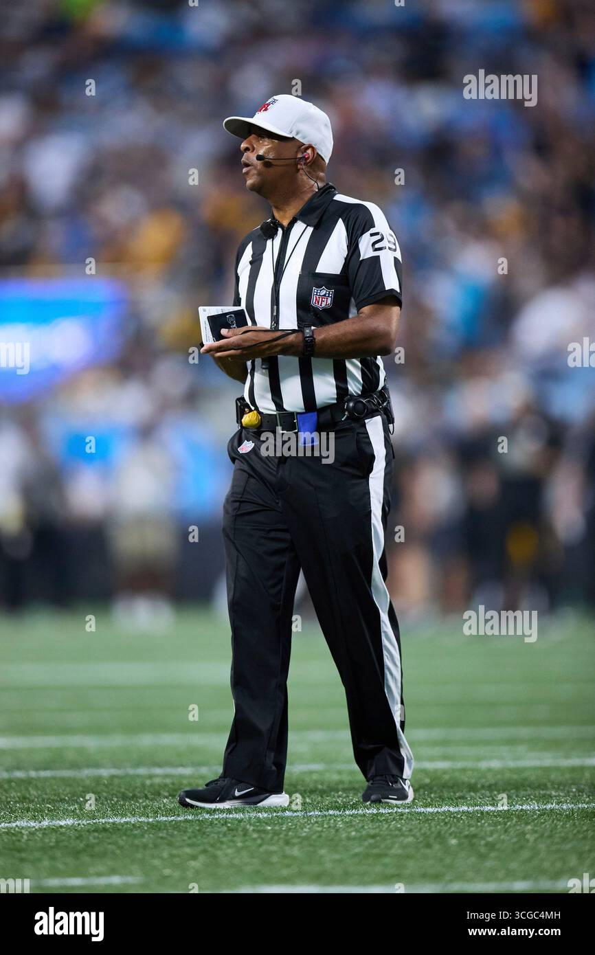 Referee Adrian Hill (29) checks his notes during an NFL preseason ...