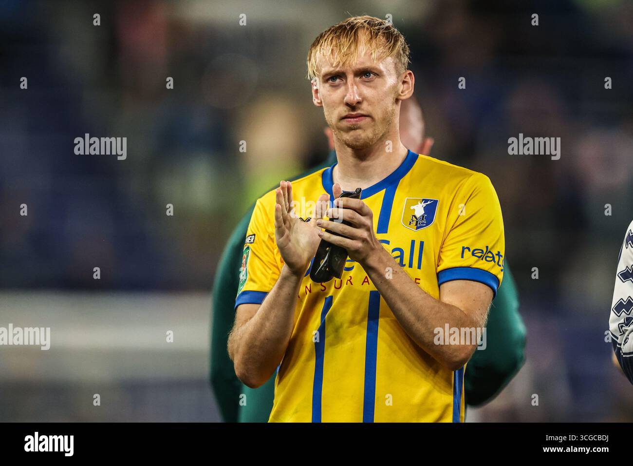 Max Dickov of Mansfield Town applauds the fans after the game during ...