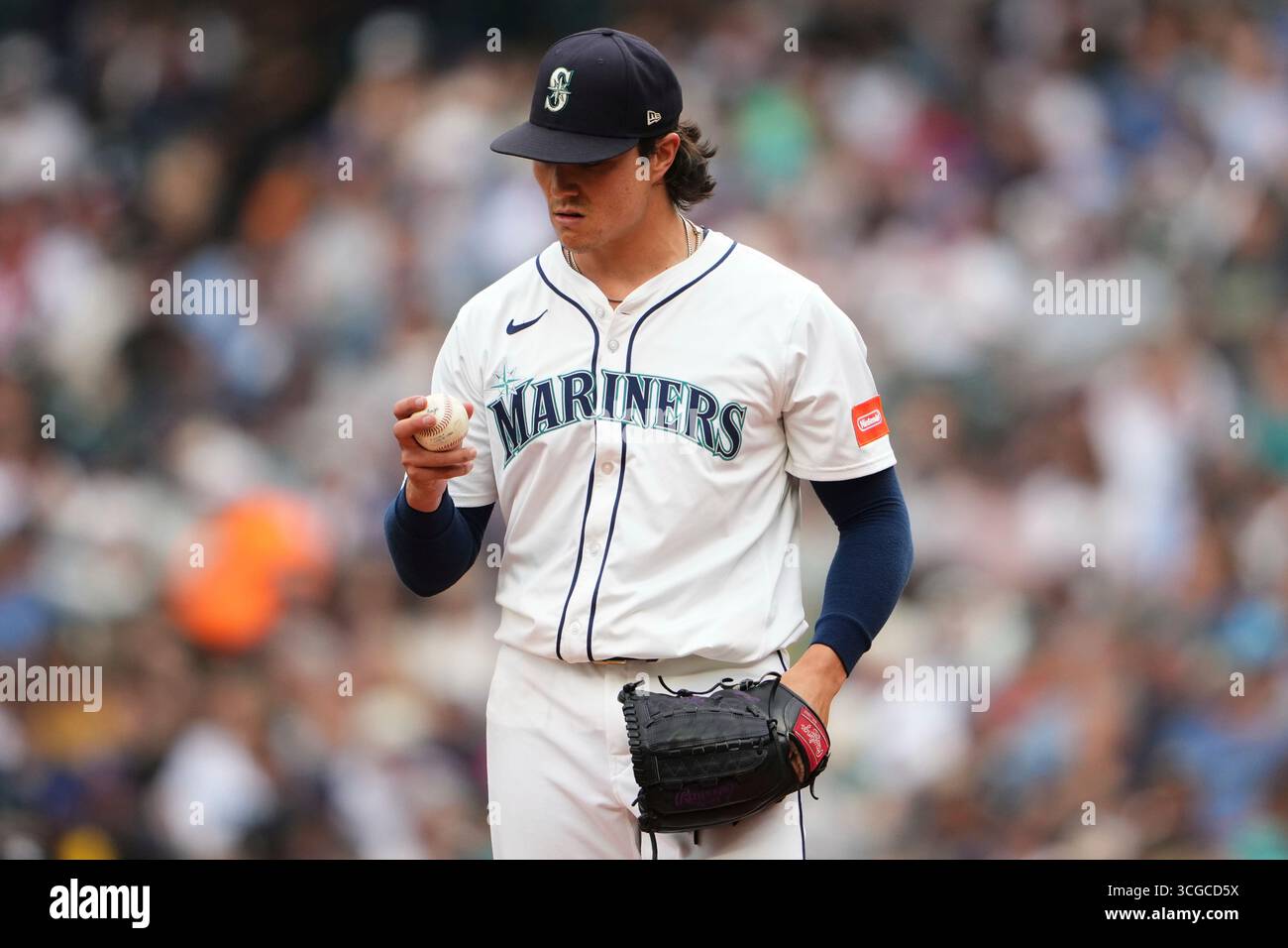 Seattle Mariners starting pitcher Bryan Woo reacts on the mound during ...