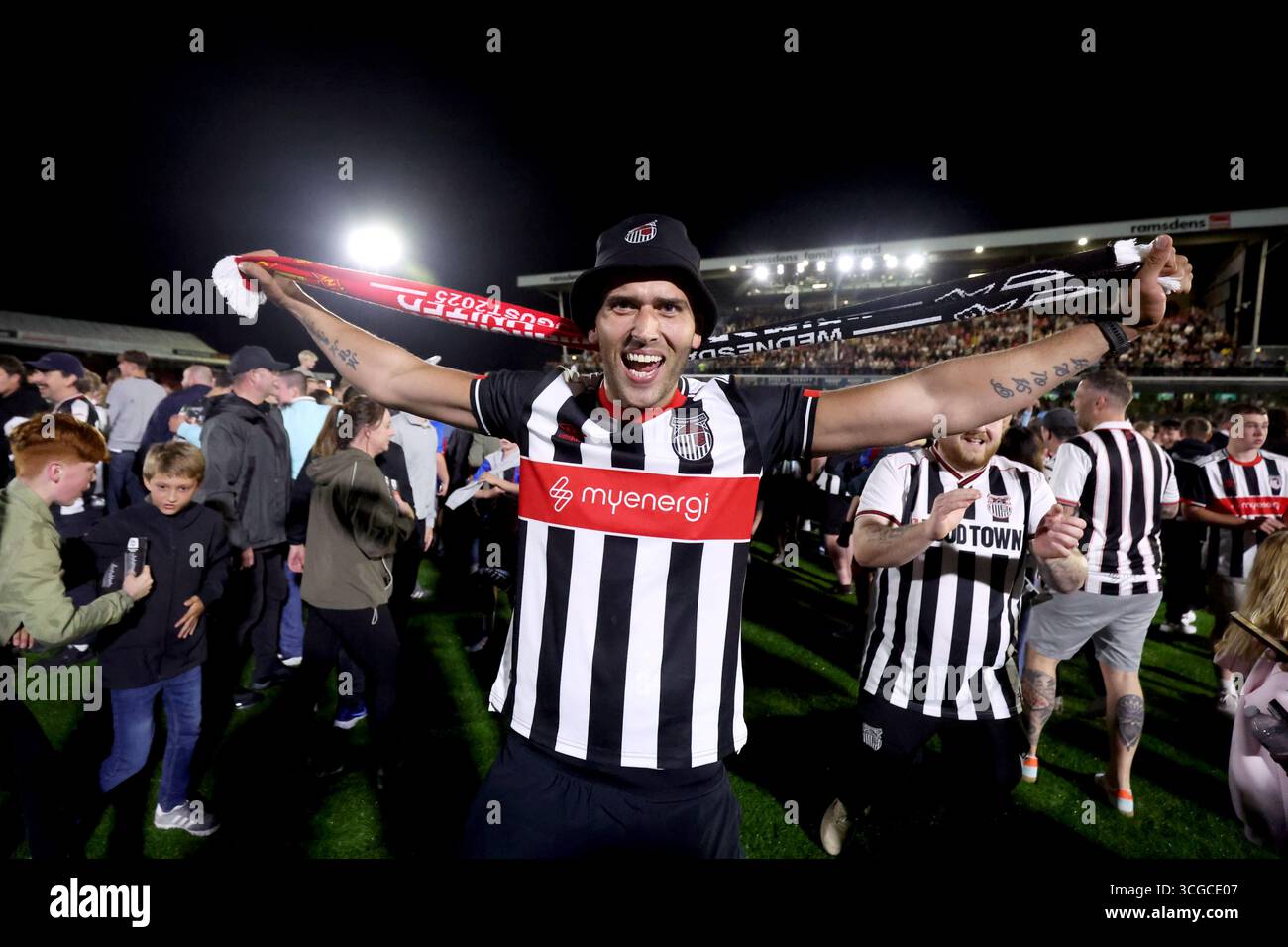 Grimsby Town fans celebrate their victory in the shoot out against ...