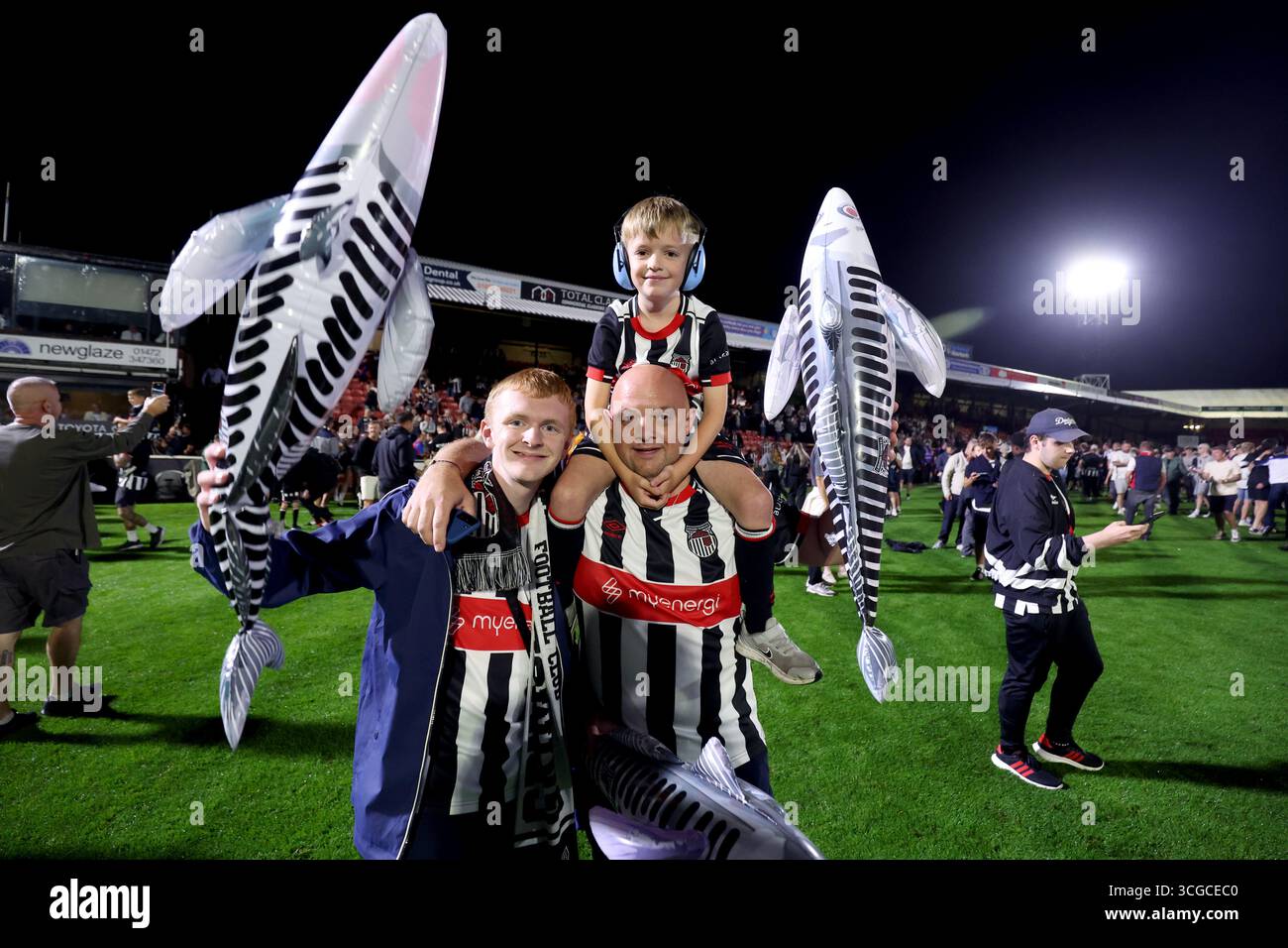 Grimsby Town’s fans celebrate their victory after their penalty shoot ...