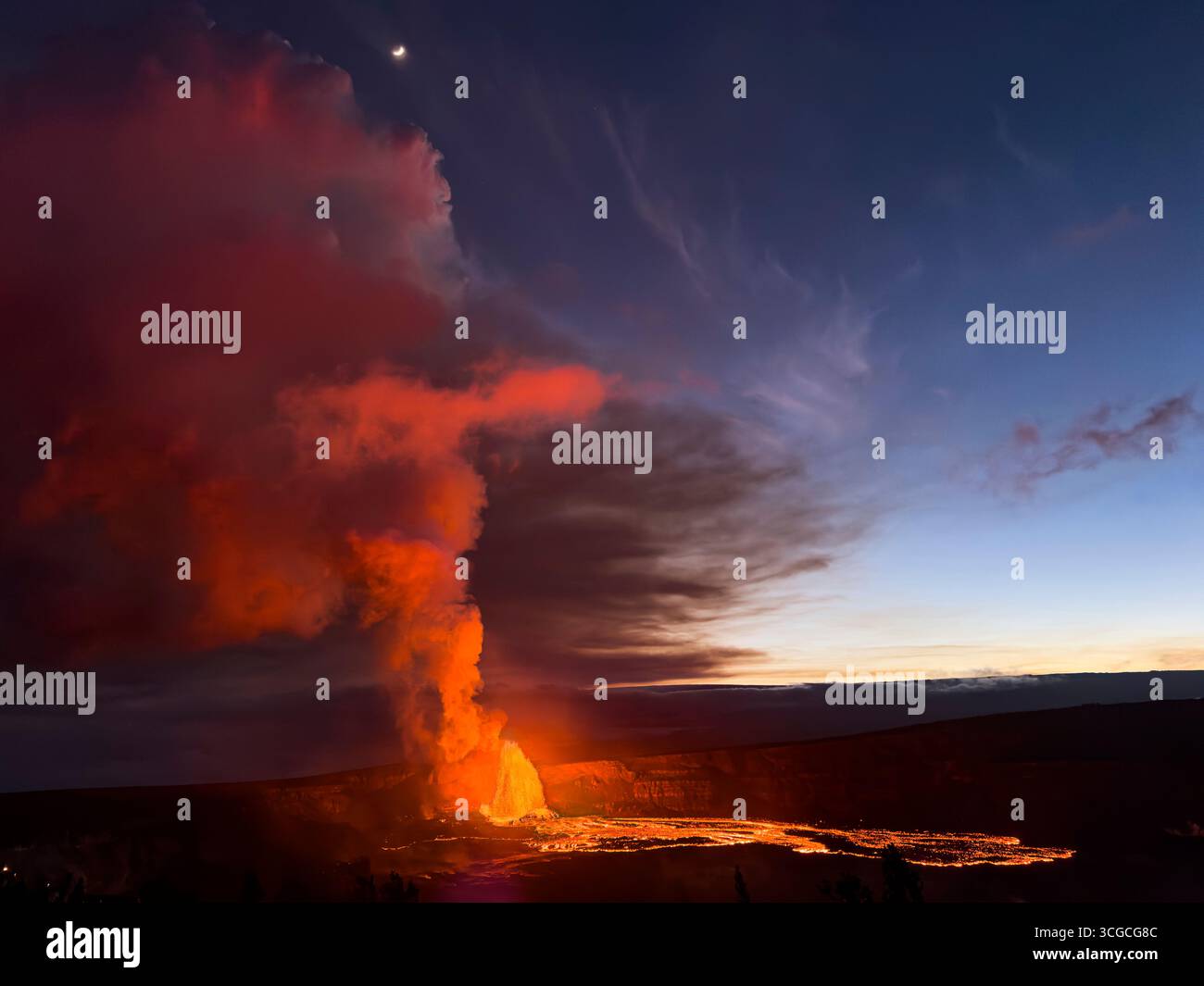 a fountain of hot lava shoots up from the caldera of Halemaumau Crater ...