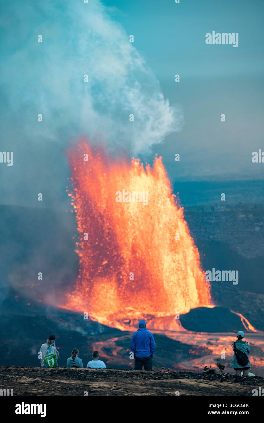 visitors gather at an overlook to view fountains of hot lava shooting ...